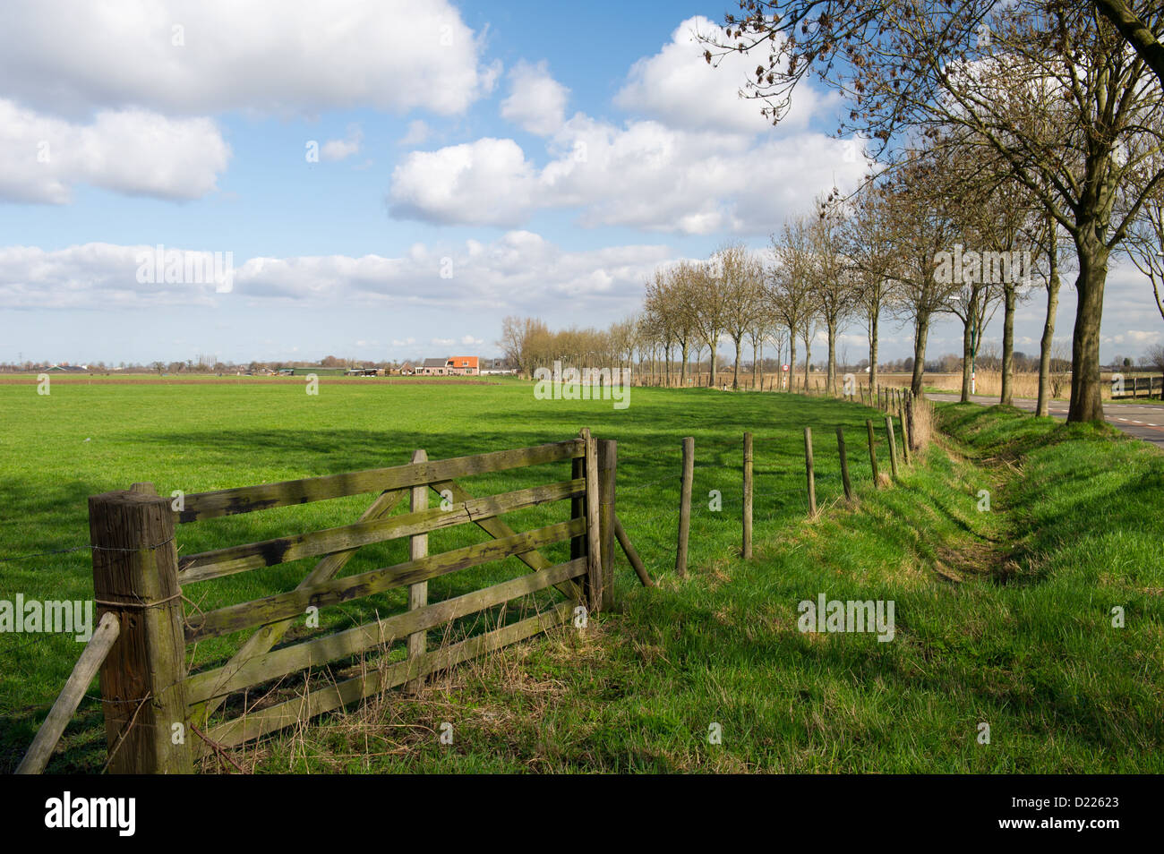 Rural landscape with meadows and fence Stock Photo - Alamy