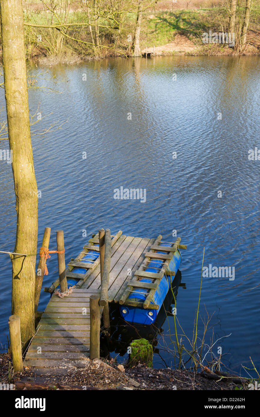 Handmade raft from shelves and plastic containers in the water Stock ...
