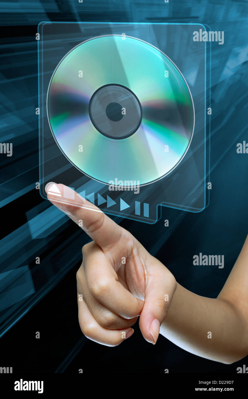 a woman finger is ejecting a dvd on a digital screen Stock Photo - Alamy