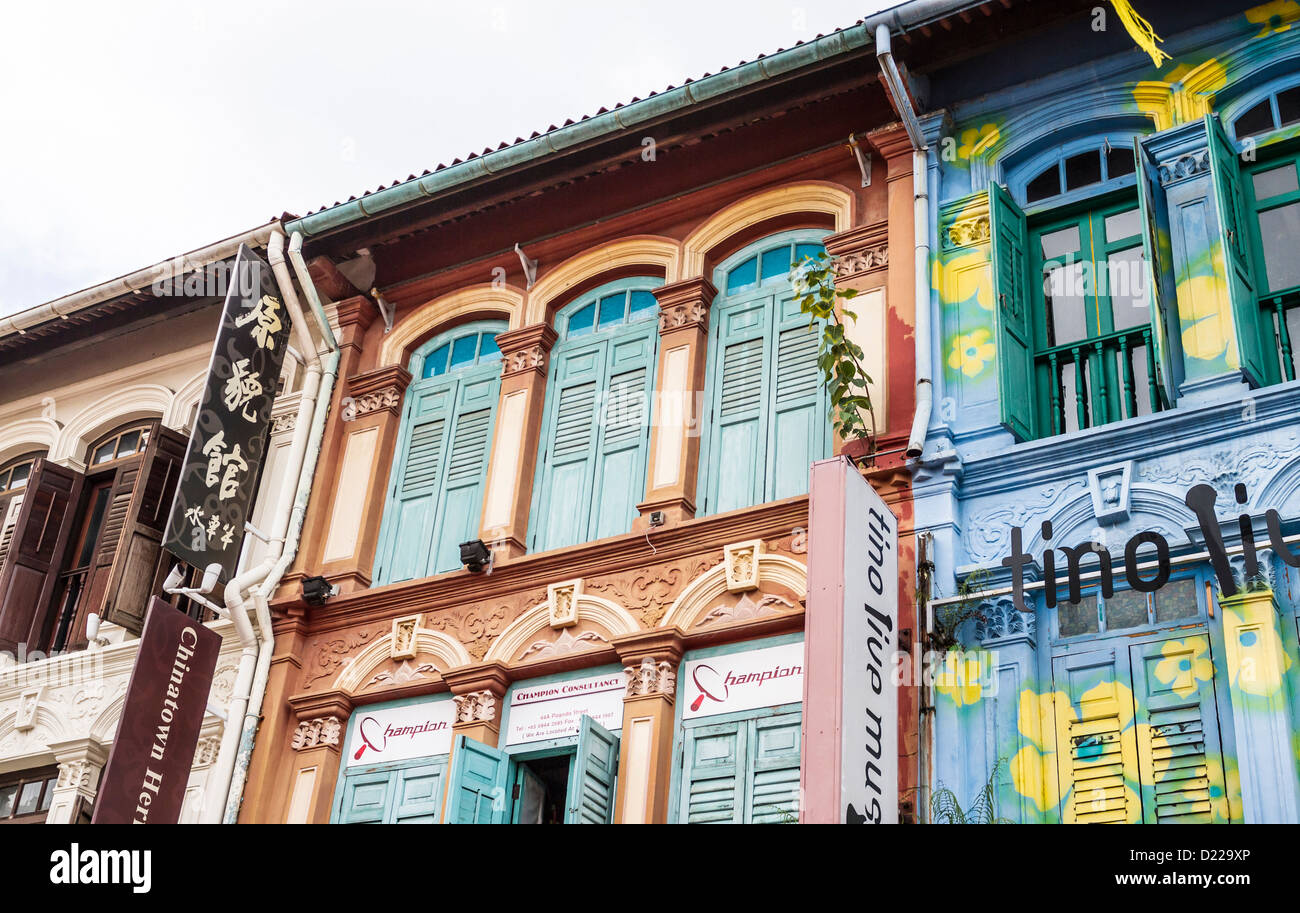 colourful window shutters above market stalls and shops in Chinatown ...