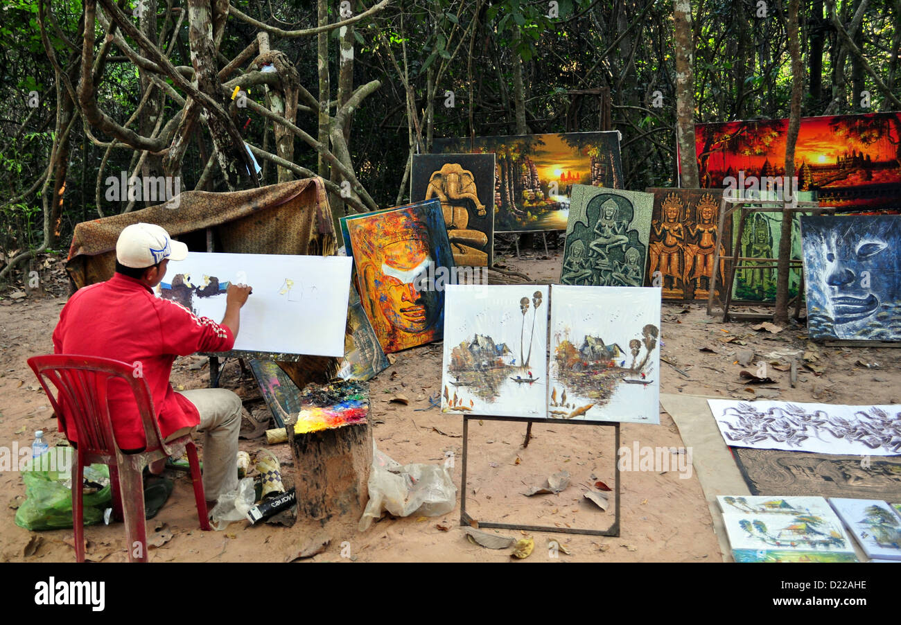 A painter drawing relics at one of the temples in Siem Reap, Cambodia ...