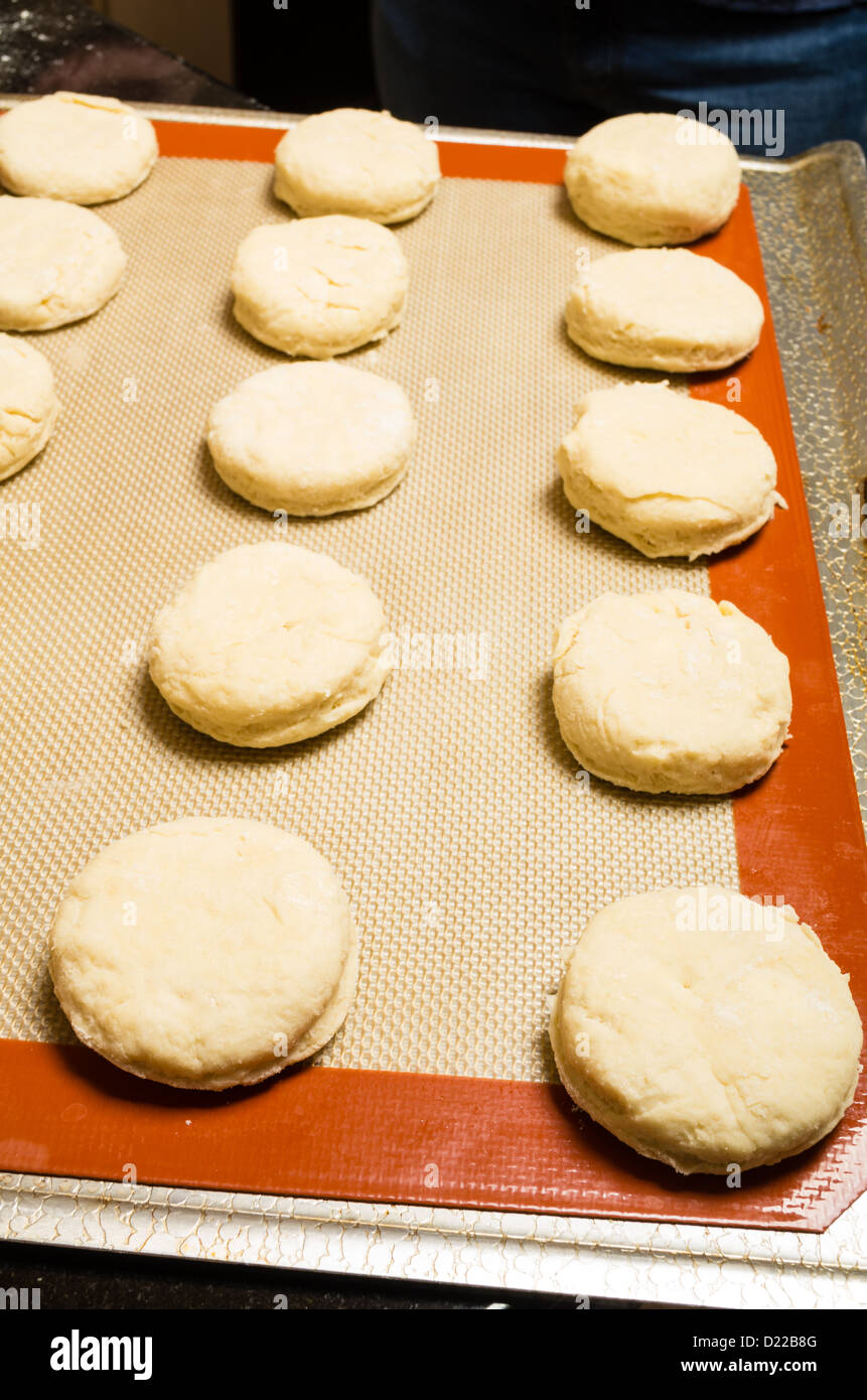 A tray of biscuits ready for the oven to begin baking Stock Photo - Alamy