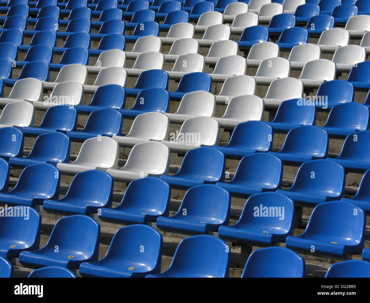 blue and white seats in the stadium Stock Photo - Alamy