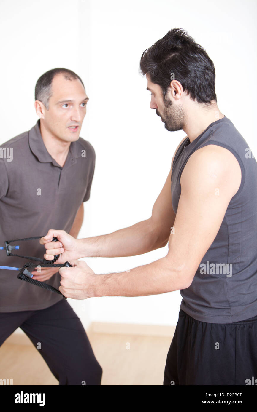 personal training of biceps strength Stock Photo - Alamy