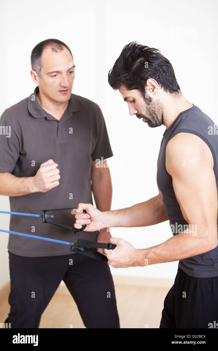 personal training of biceps strength Stock Photo - Alamy