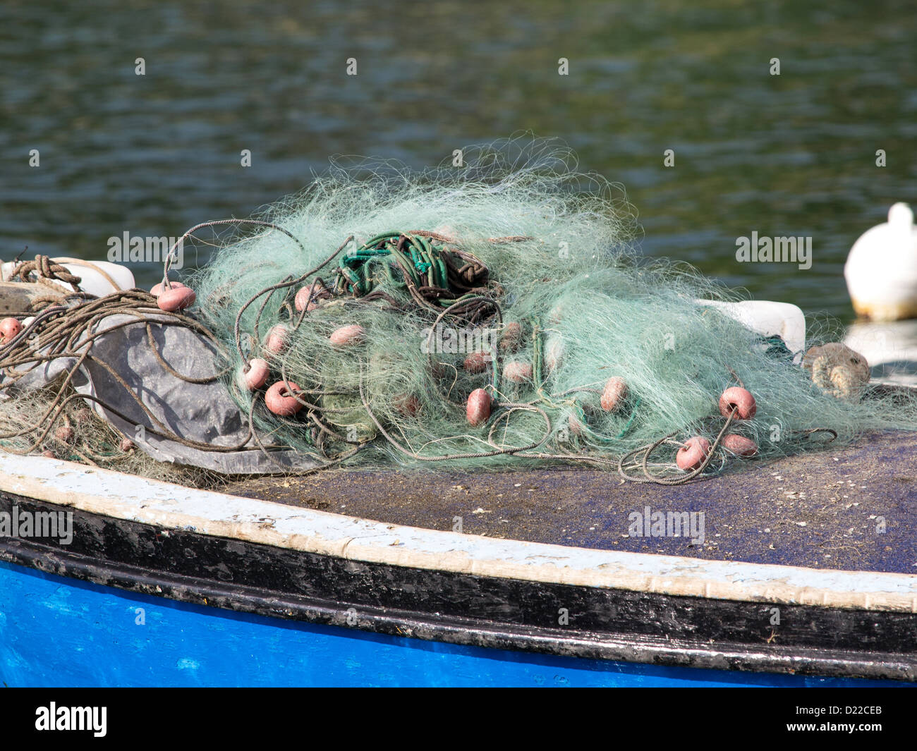 fishing net on the blue boat Stock Photo - Alamy