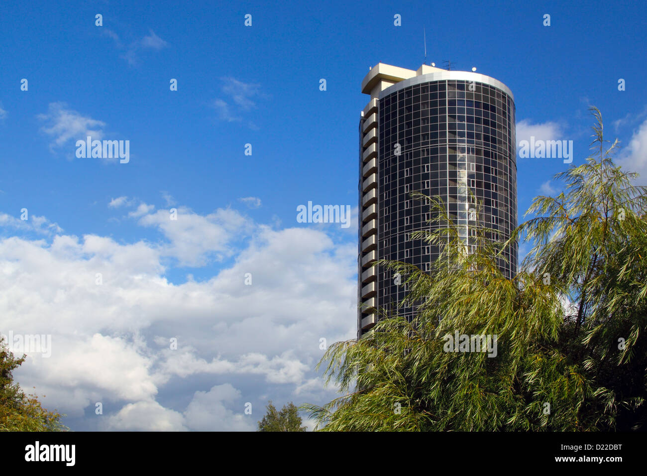 Modern high-rise building against the dark blue sky Stock Photo - Alamy