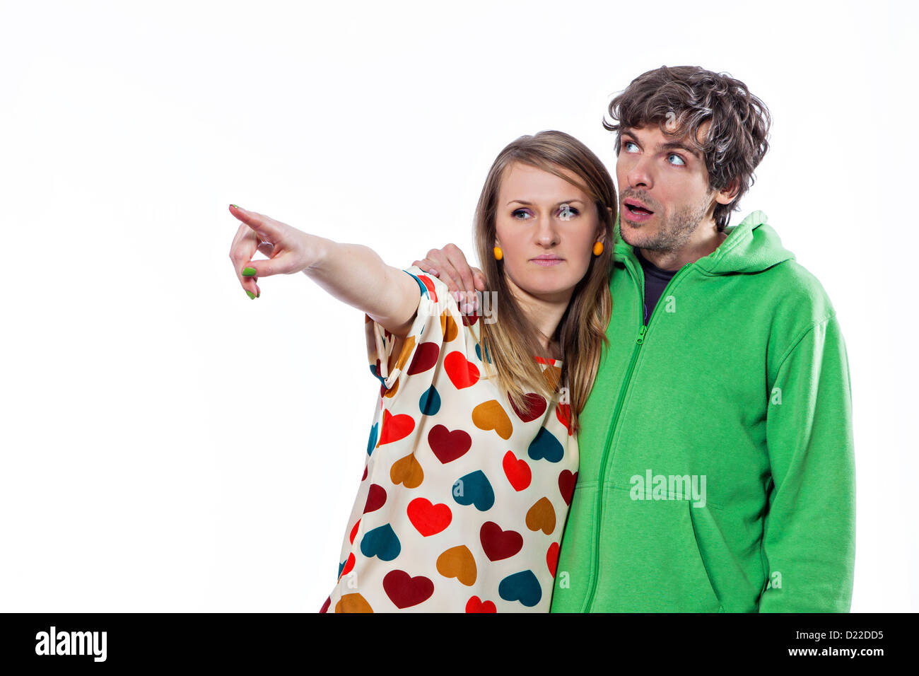 Young couple pointing at something Stock Photo - Alamy