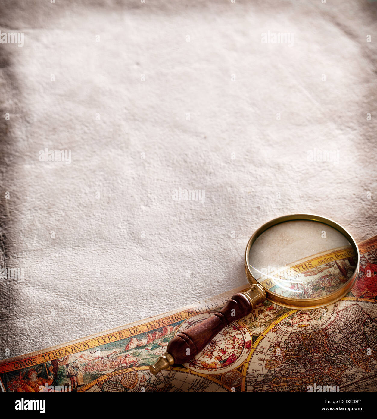 Magnifying glass on old parchment Stock Photo - Alamy
