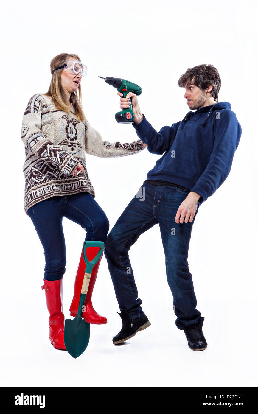 Young couple playing with different tools Stock Photo - Alamy
