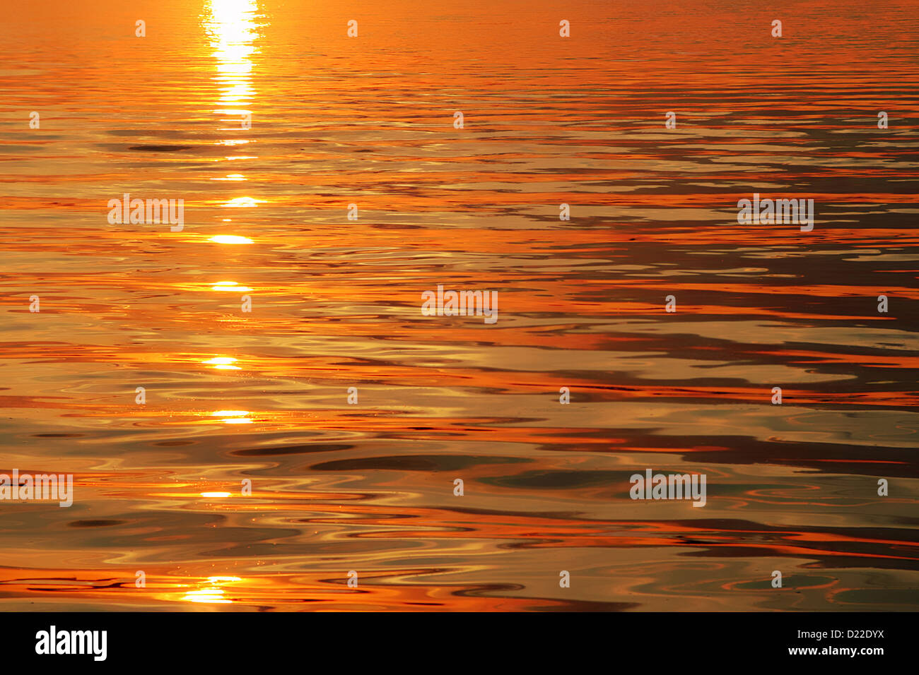 Beautiful sunset water background Stock Photo - Alamy