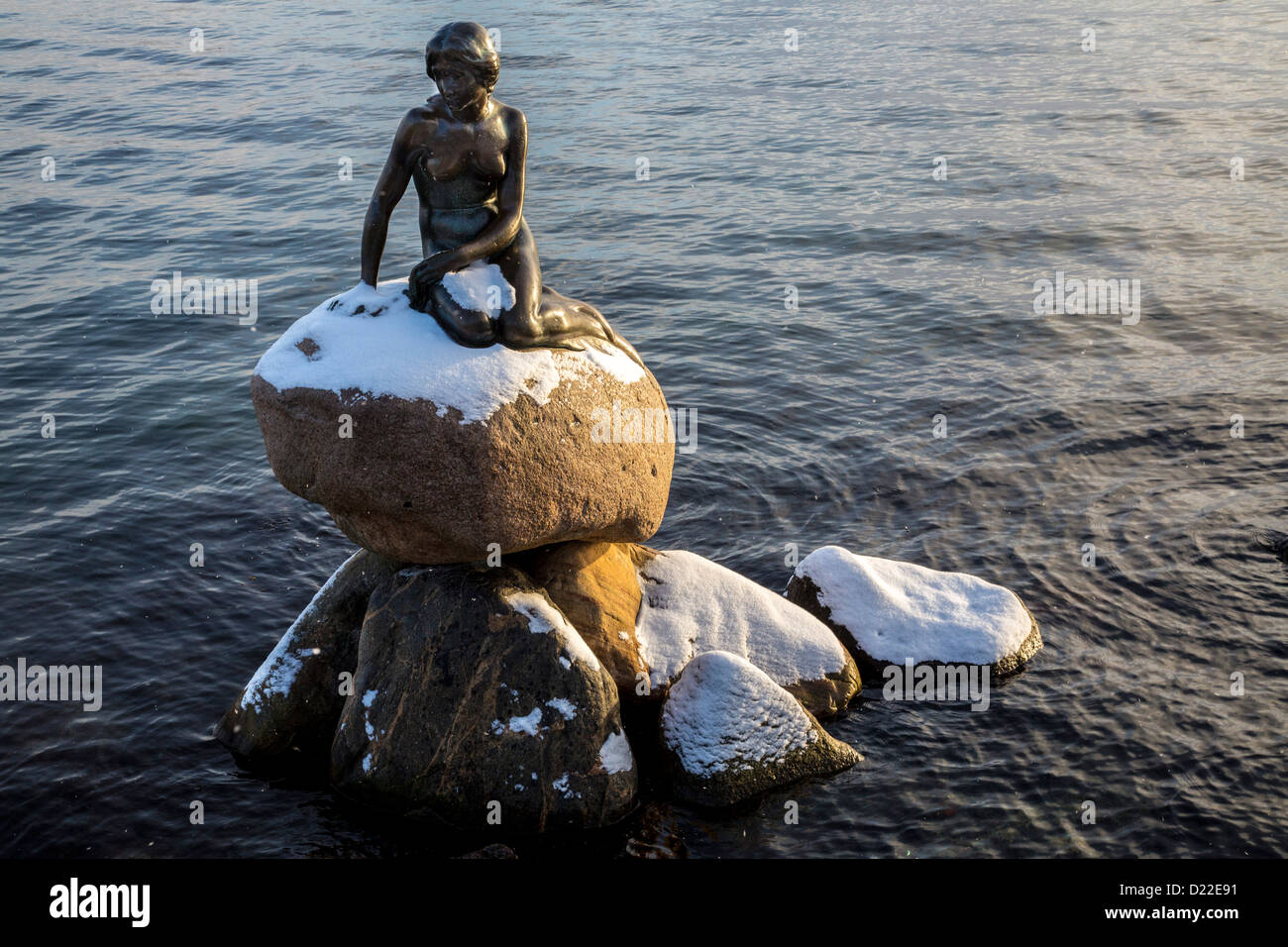 Wintertime in Copenhagen. Little mermaid sculpture in the port area ...