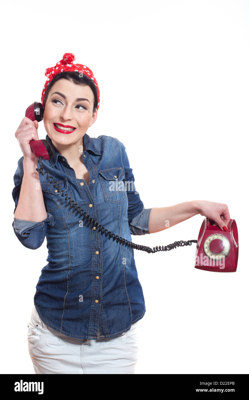 Woman with red kerchief holding a phone Stock Photo - Alamy