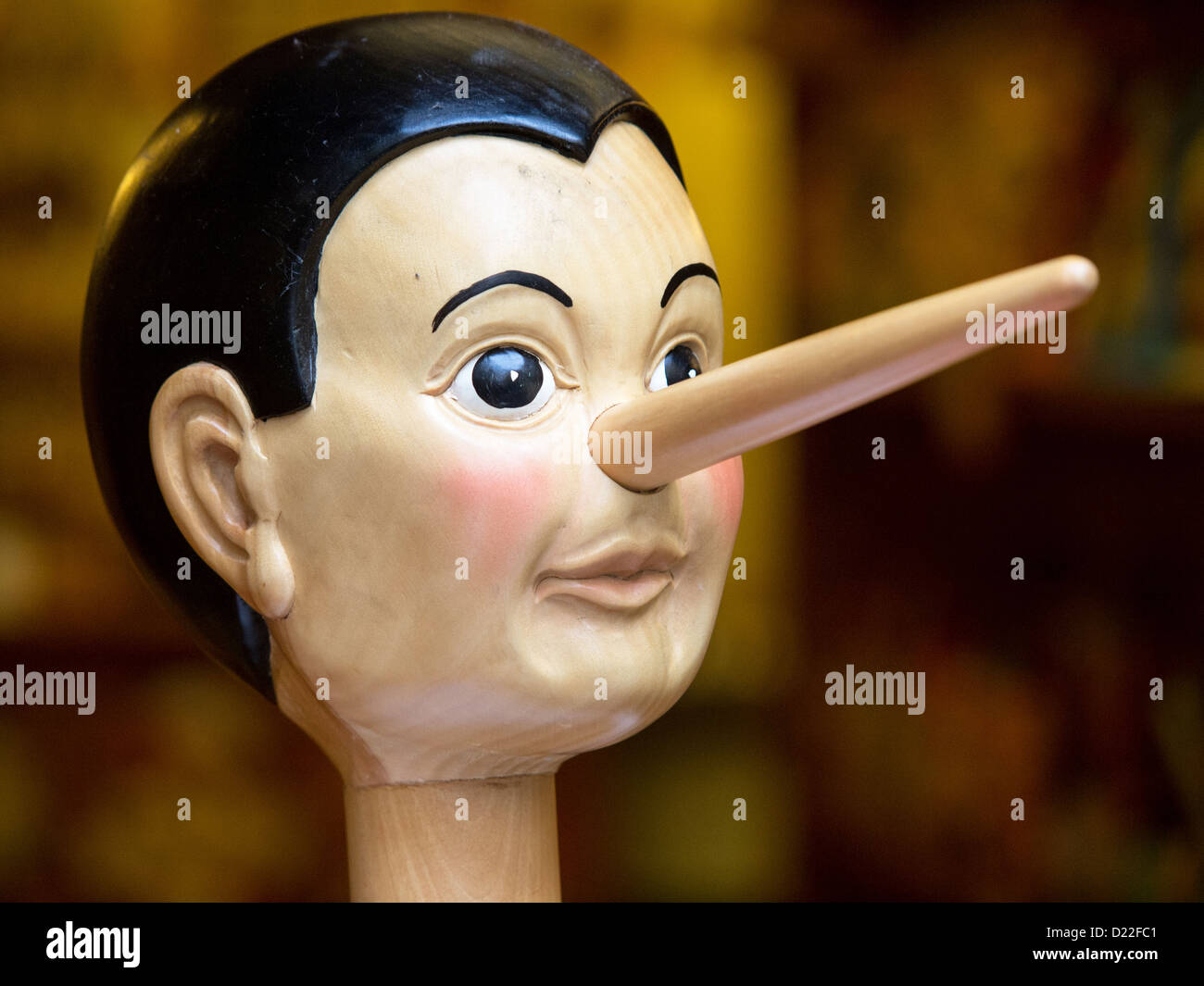Wooden pinocchio doll with his long nose Stock Photo - Alamy