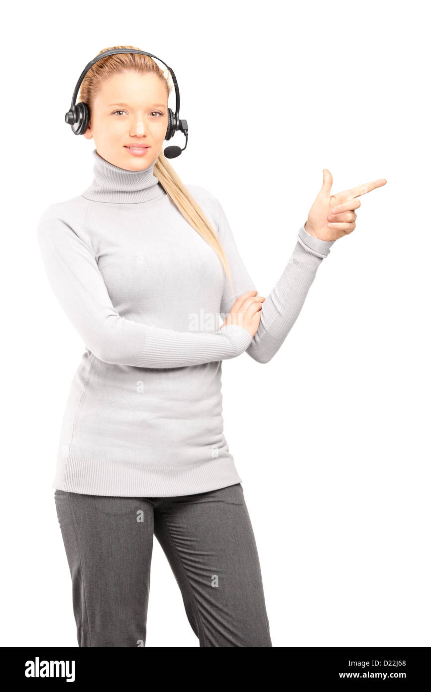 Female customer service operator with headphones pointing with finger ...
