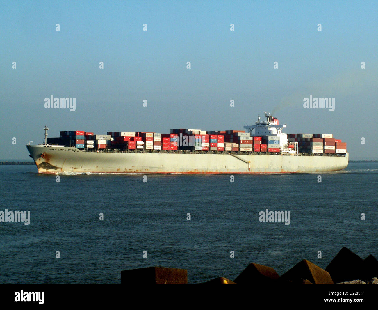 A commercial vessel crosses the Suez Canal Bridge, leaving the Port of ...