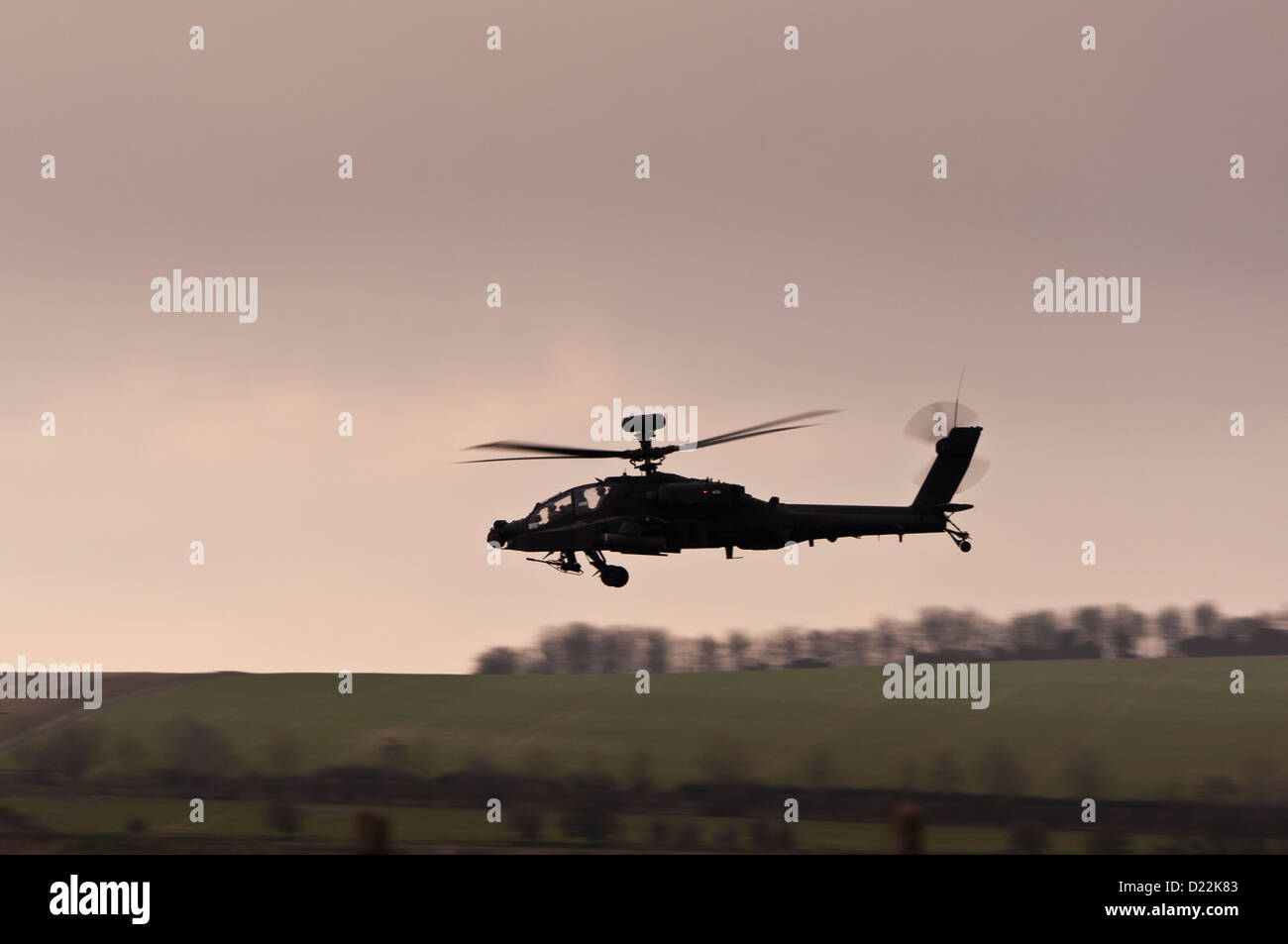 British Apache helicopter gunship on training flight across English ...