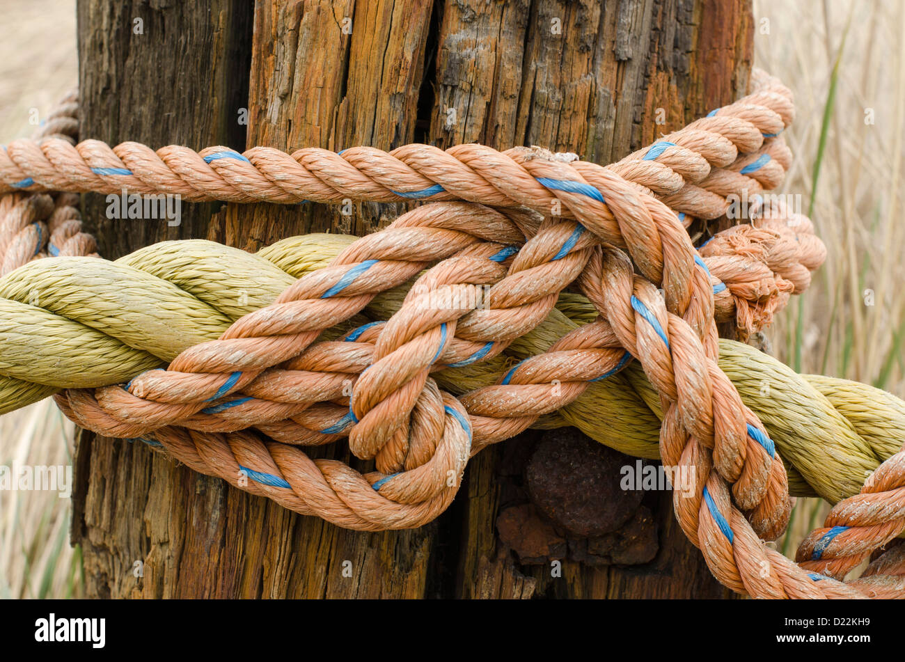 Shipping Ship Rope Knotted around Wooden Post Stock Photo - Alamy