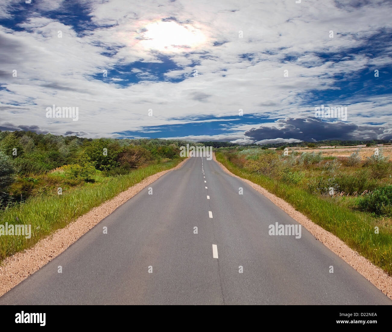 Road in field in storm time Stock Photo - Alamy