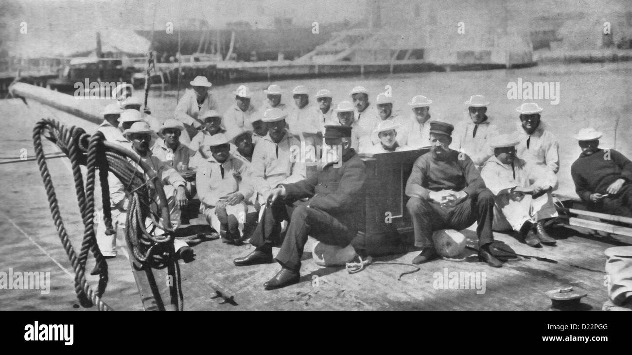 Crew of old sibling ship sitting on the dock, circa 1900 Stock Photo ...