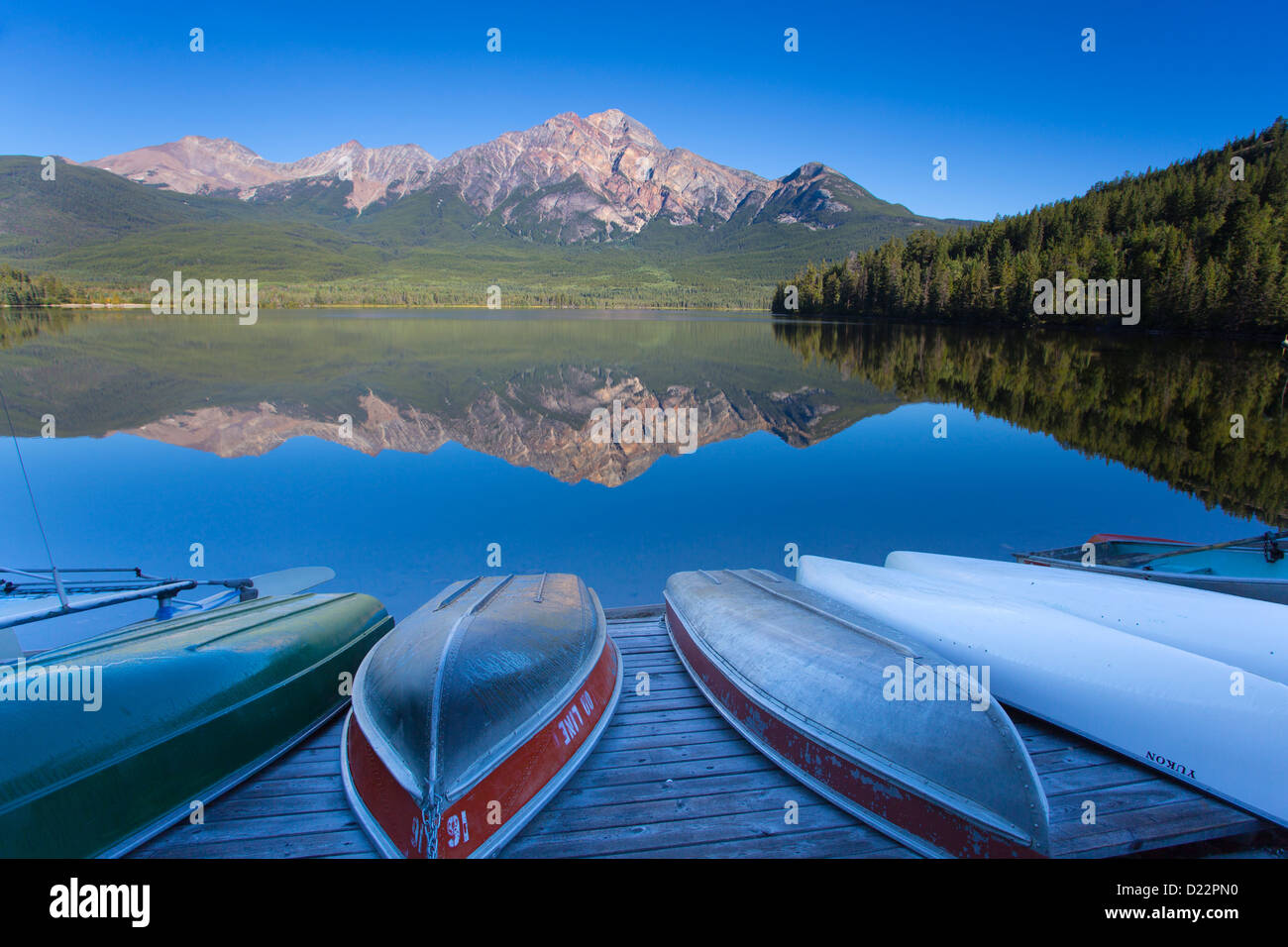 Boats on dock with Pyramind Mountain across Pyramind Lake In Jasper ...