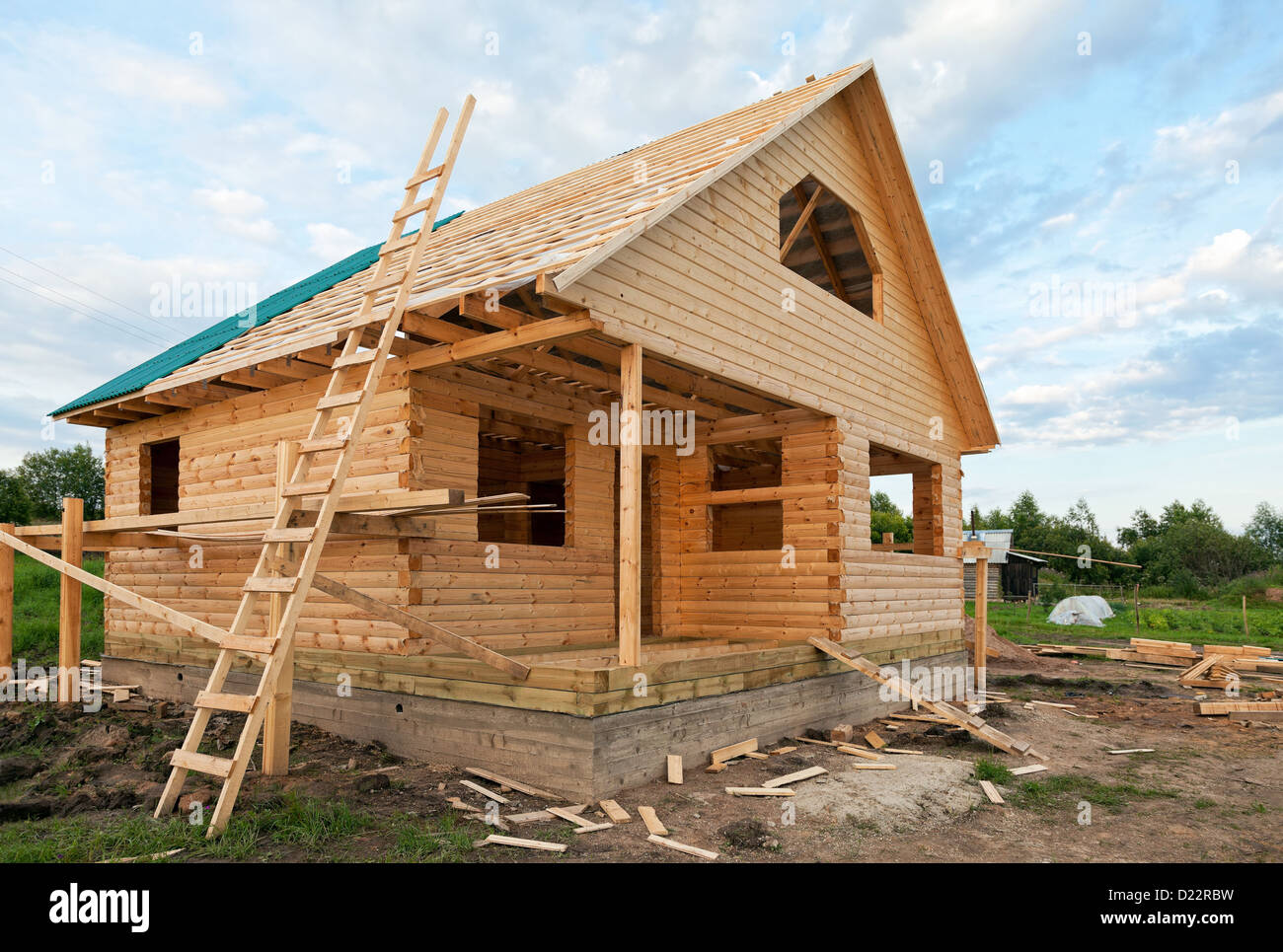 Wooden house under construction Stock Photo - Alamy