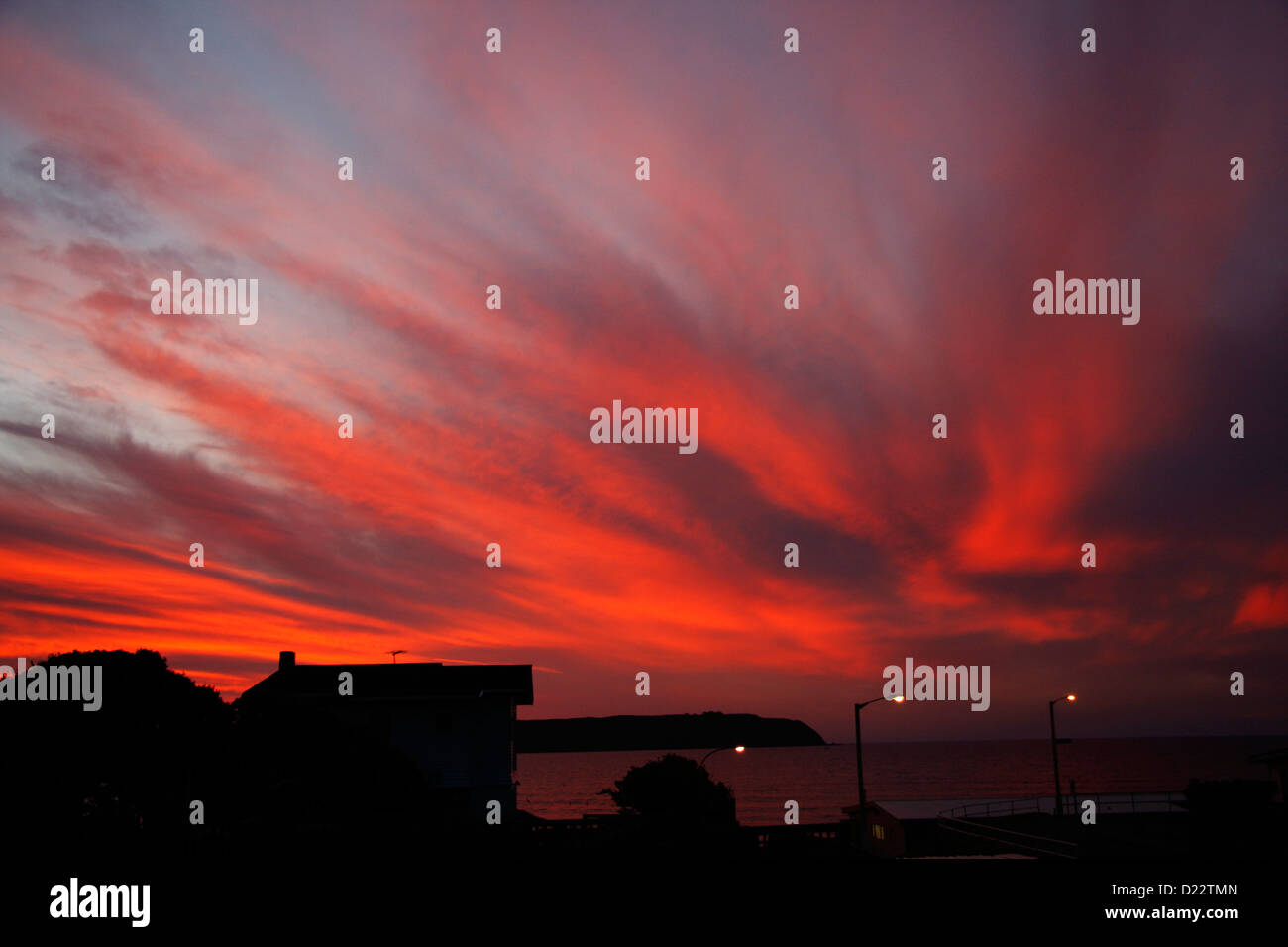 A bright red sky over Mana Island after sun-set, shot from Titahi Bay ...