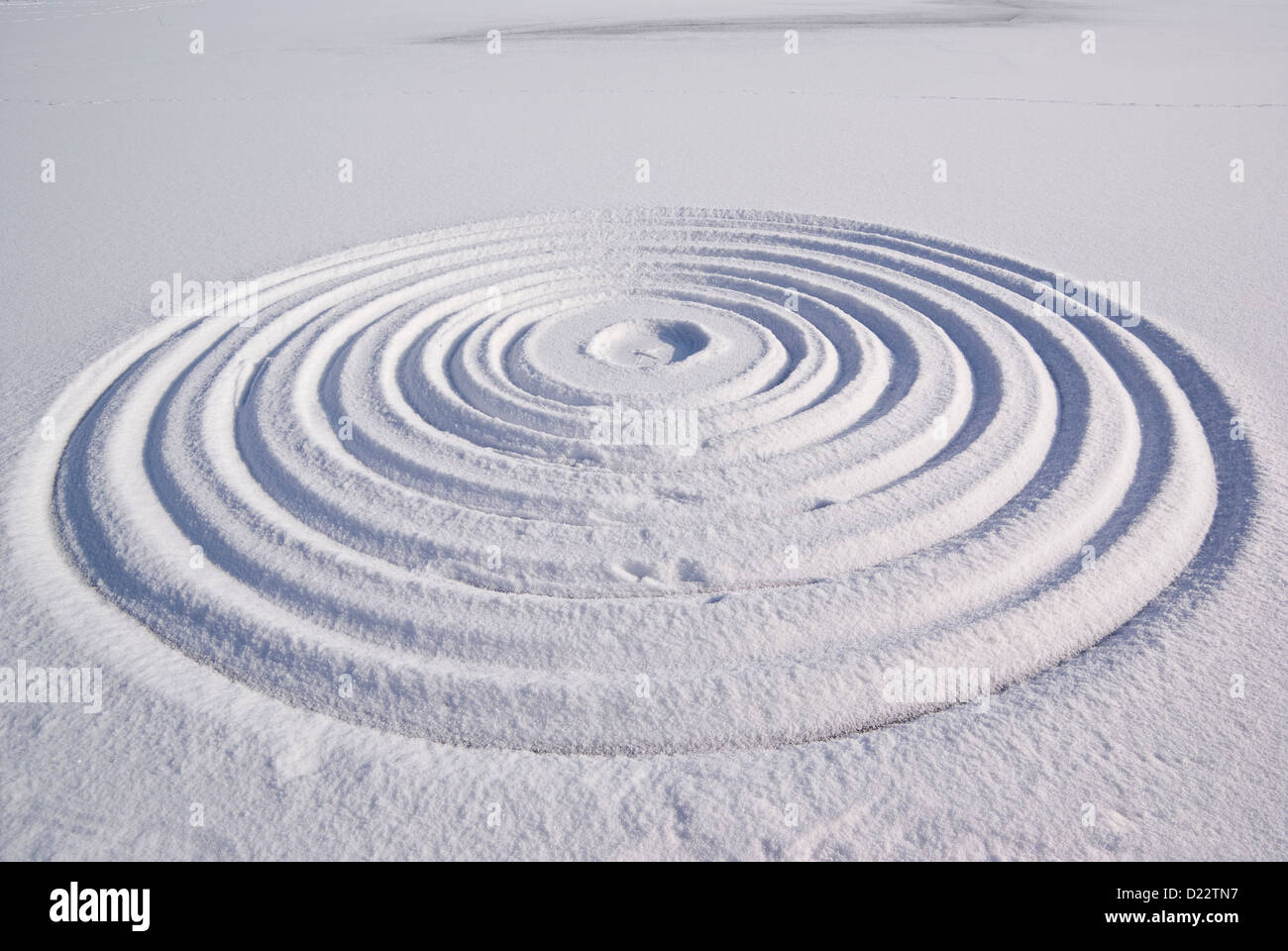 drawn different circles of size on snow Stock Photo - Alamy