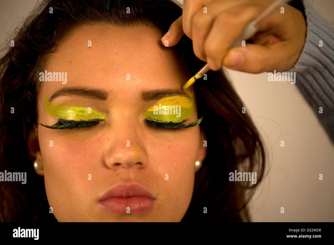 Make up artist Erika Monroy, founder of Akin Body Painting, paints a ...