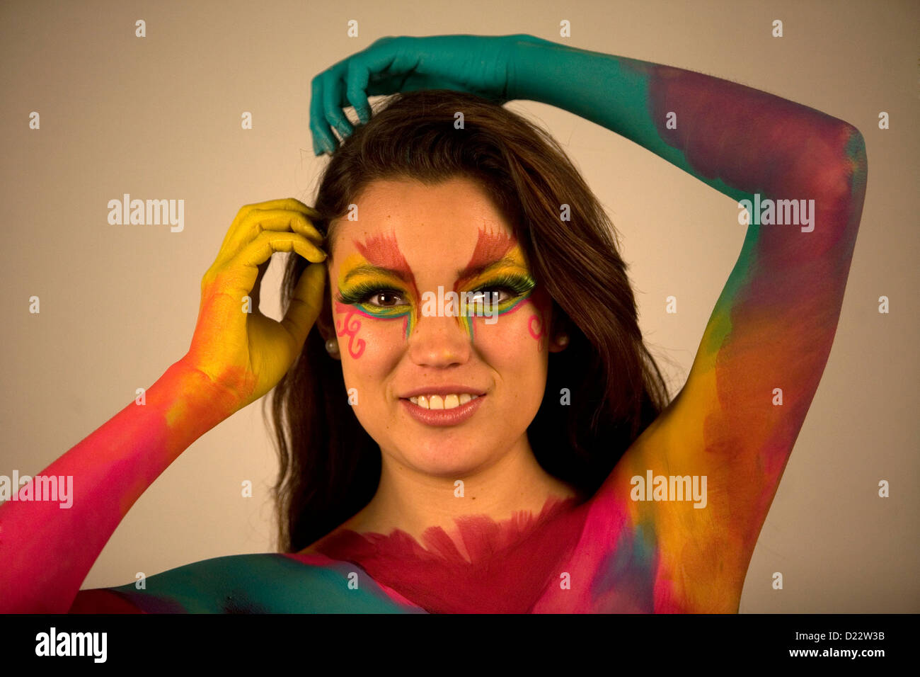 A model smiles during a body painting session with make-up artist Erika ...
