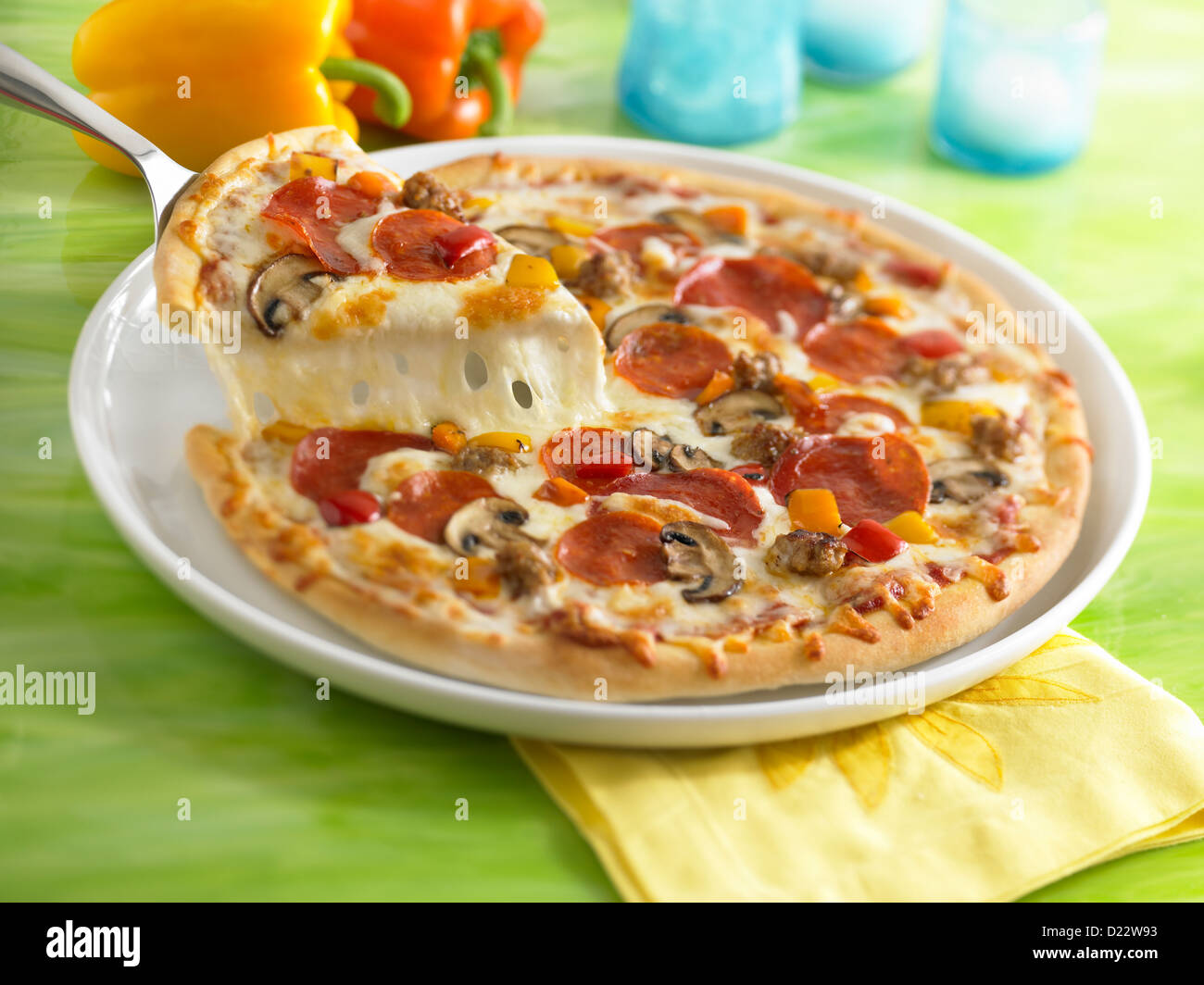 Pepperoni sausage pizza pull Stock Photo - Alamy