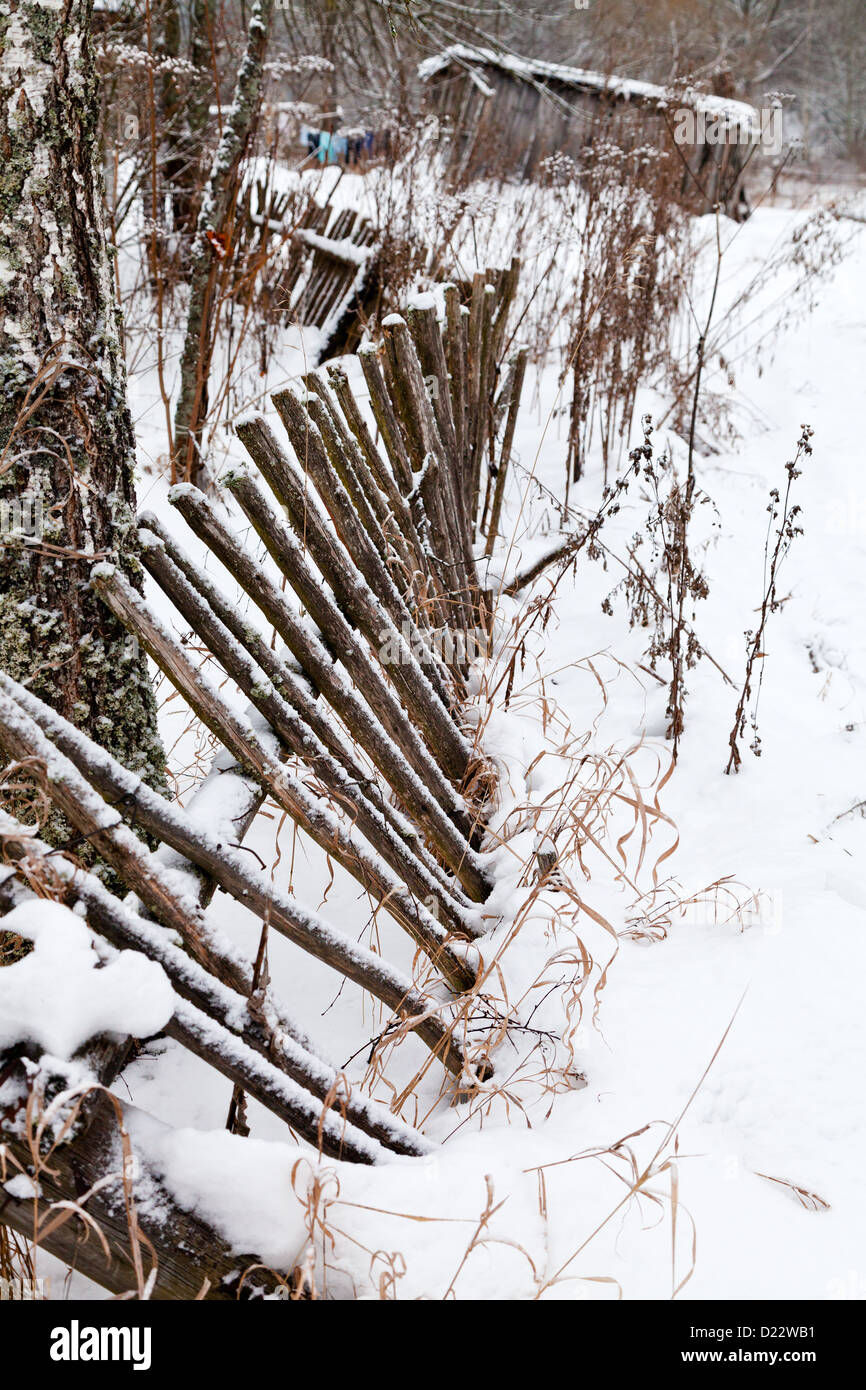 backyard rickety fence in winter village Stock Photo - Alamy