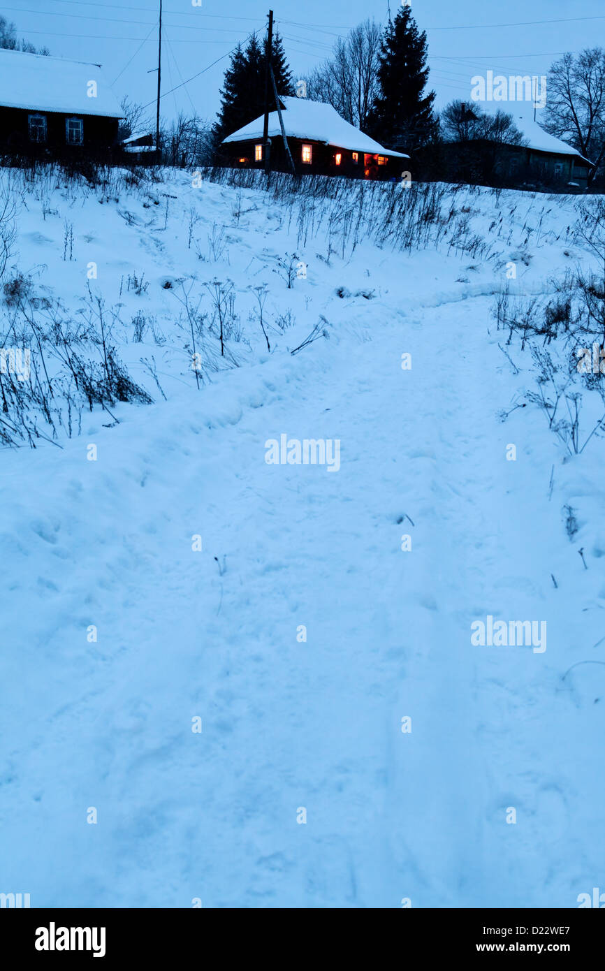snow pathway in country village at dark blue evening gloaming Stock ...