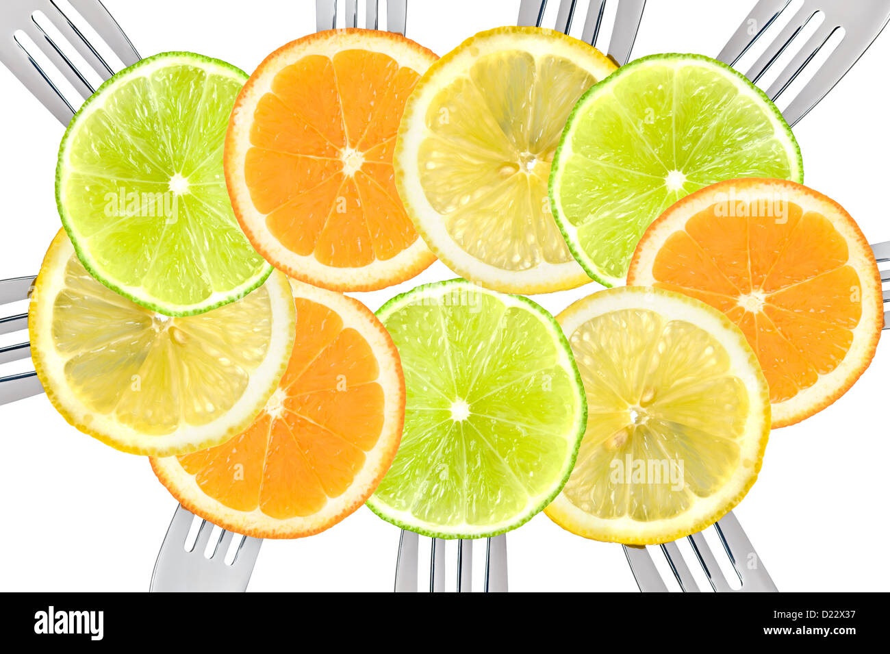 many slices of mixed citrus fruit on forks forming a repeat pattern ...