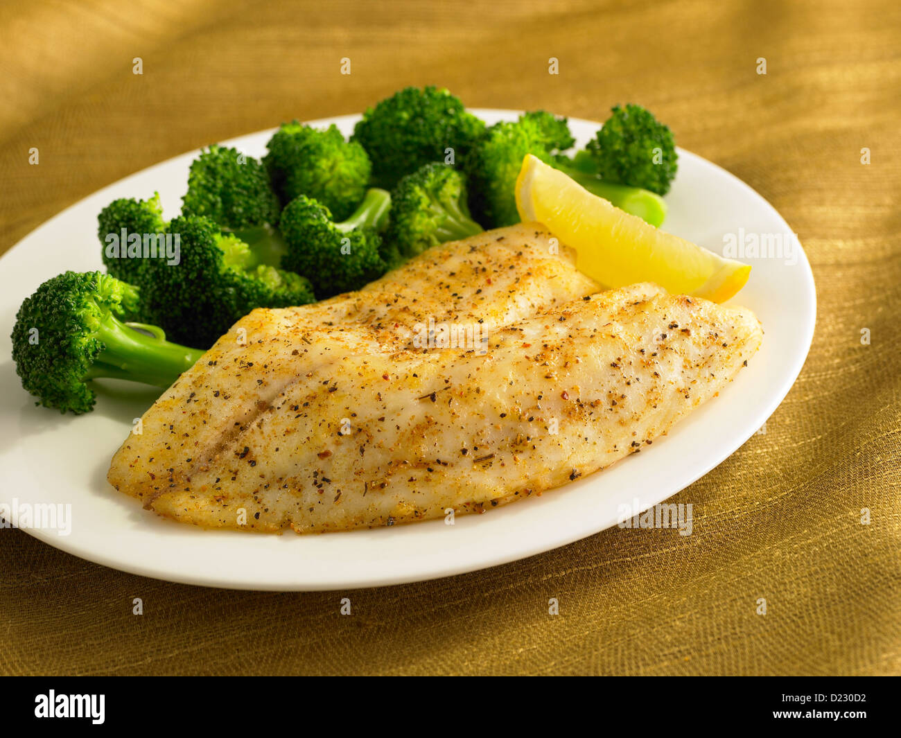 Sole fish fillet served with broccoli Stock Photo - Alamy
