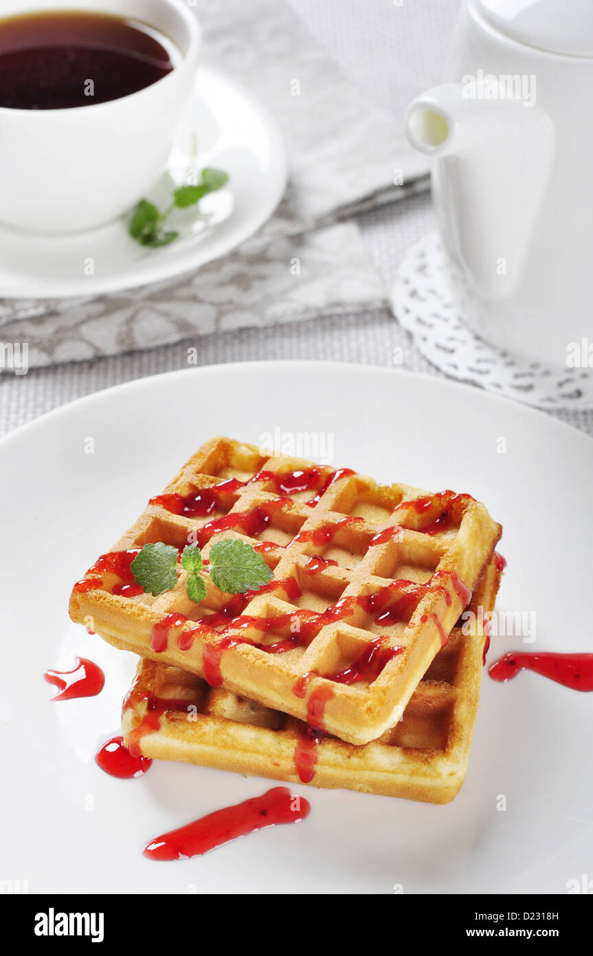 Waffles served with strawberry jam and mint Stock Photo - Alamy