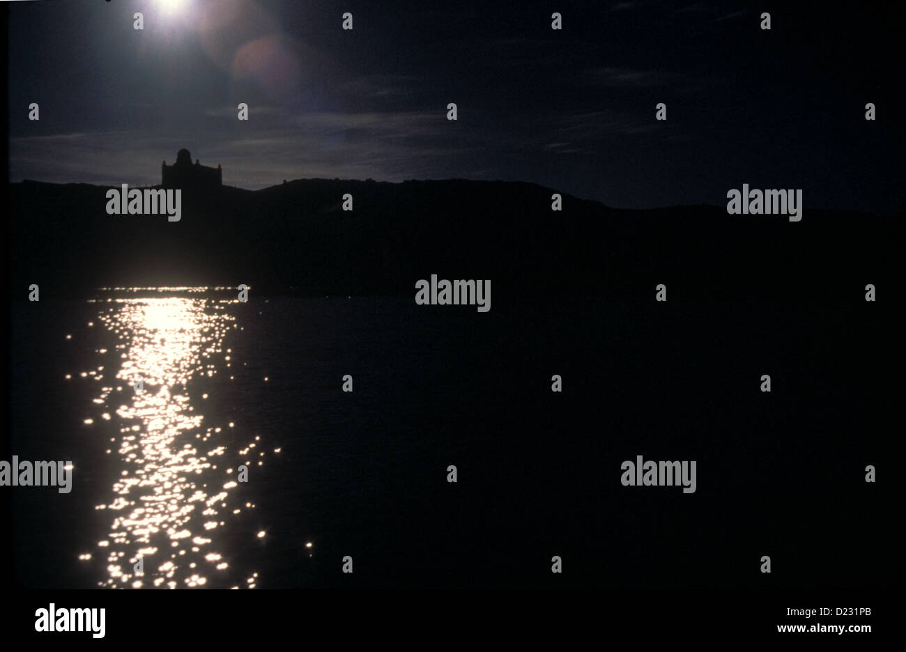 Full moon over the Aga Khan's tomb overlooking the Nile river in Aswan ...