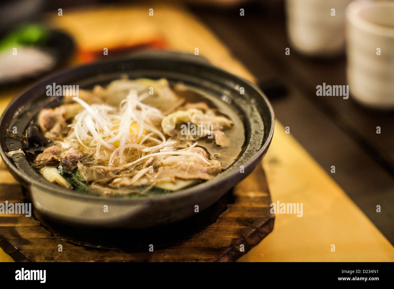 Japanese stone pot meals with beef, noodles and vegetables in a healthy ...