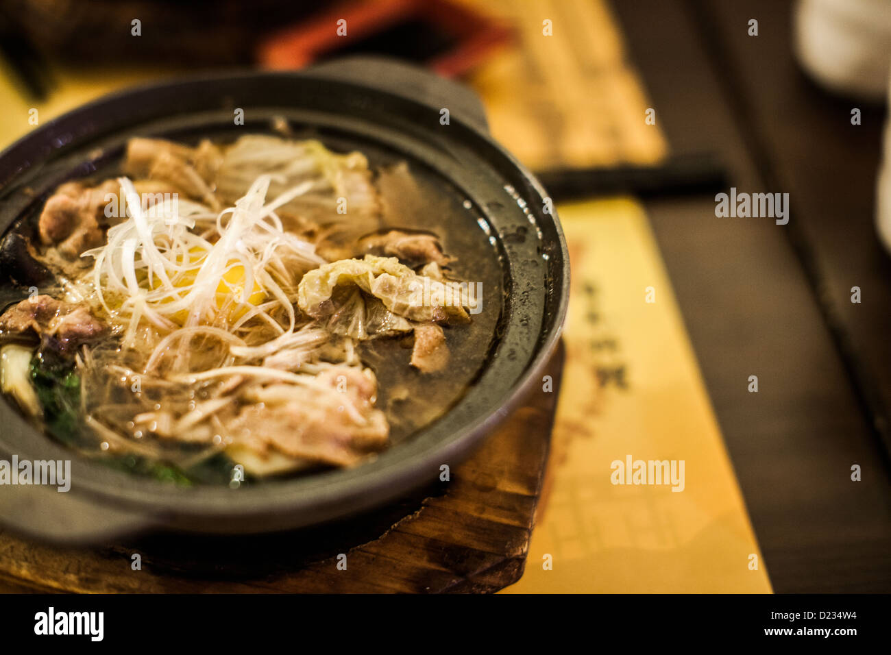 Japanese stone pot meals with beef, noodles and vegetables in a healthy ...