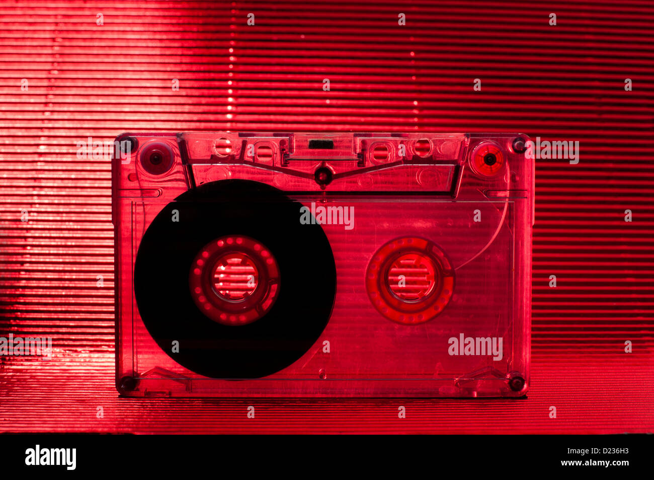 Transparent Cassette tape. Red color background Stock Photo - Alamy