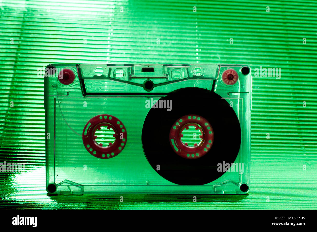 Transparent Cassette tape. Green color background Stock Photo - Alamy