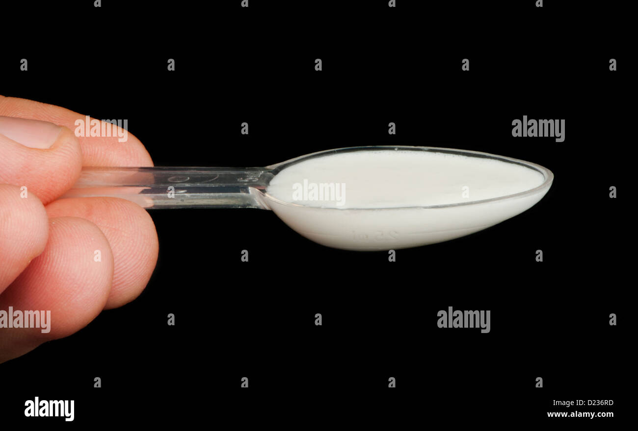 Antibiotic liquid put in a spoon Stock Photo - Alamy