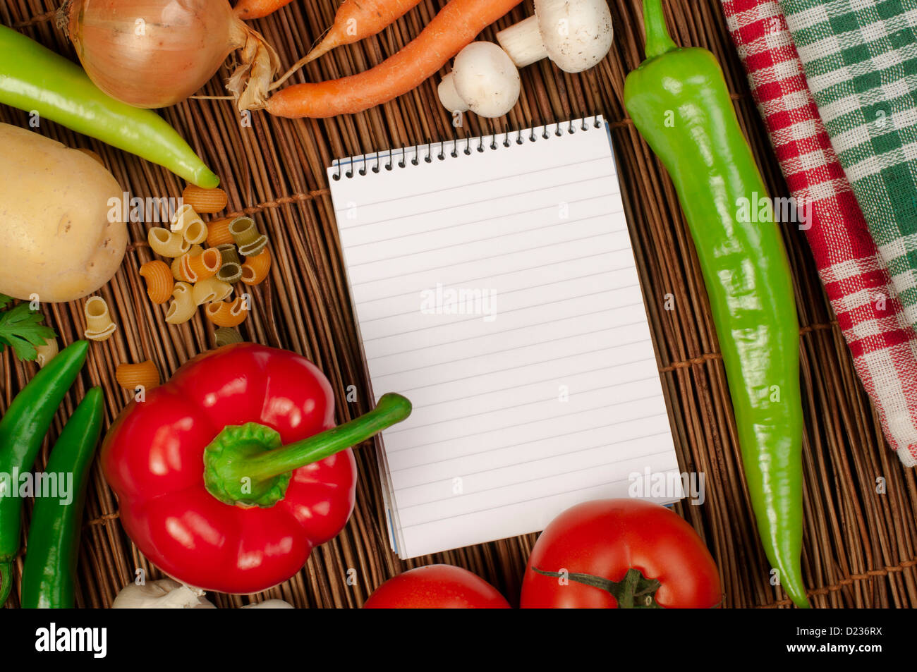 Notebook to write recipes and vegetables around it Stock Photo - Alamy