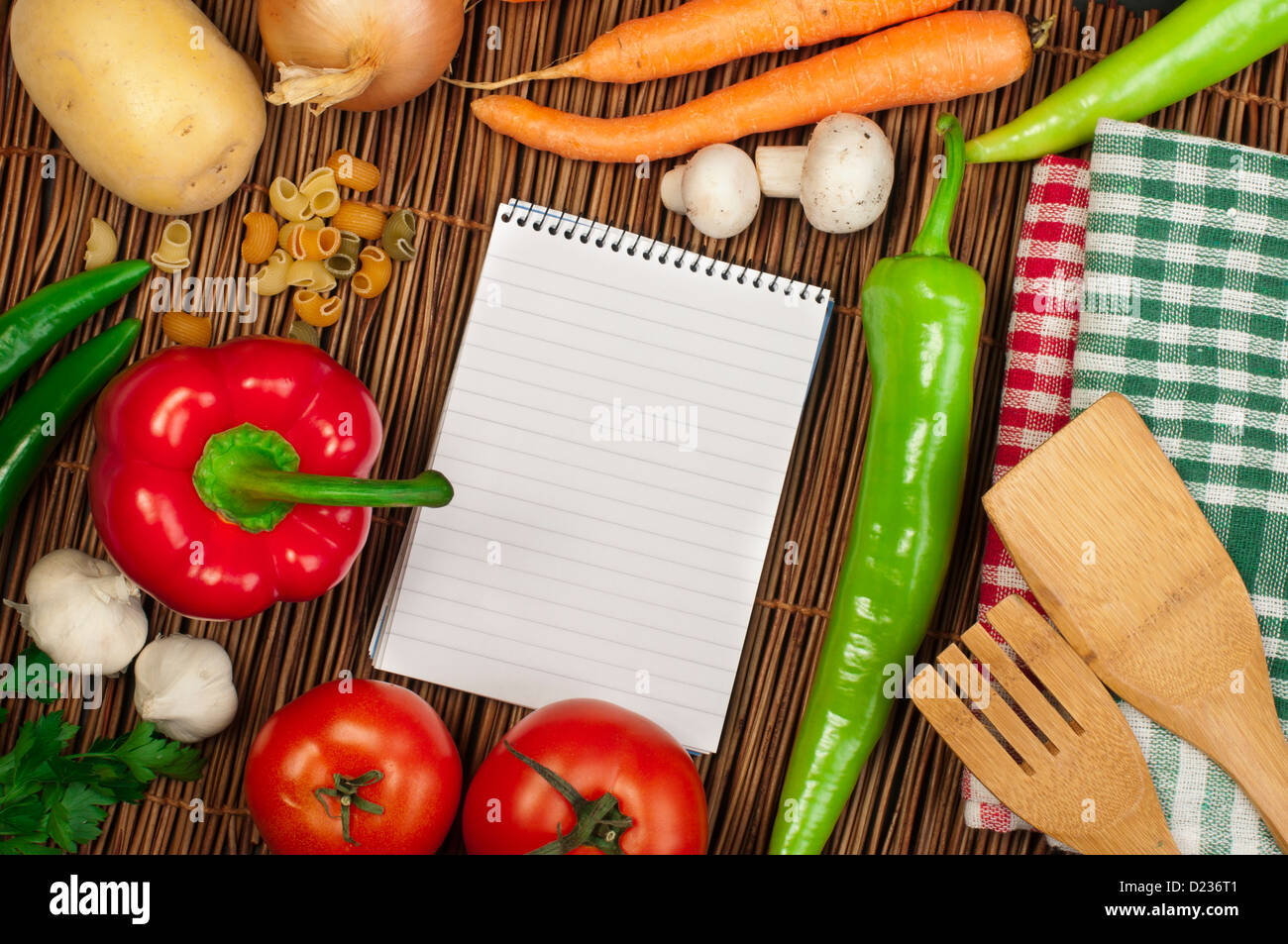 Notebook to write recipes and vegetables around it Stock Photo - Alamy