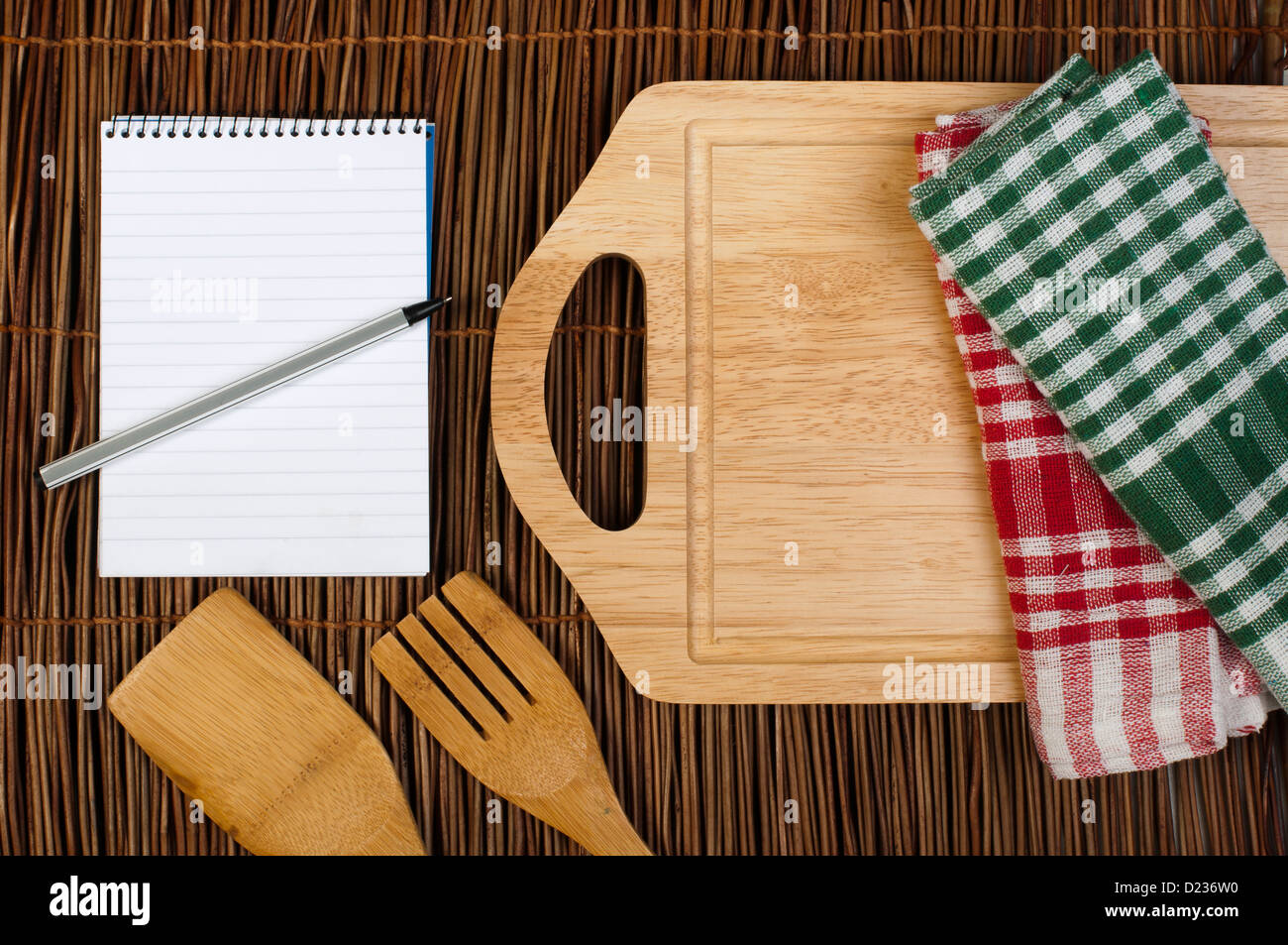 Notebook to write recipes,Wooden spoon and fork and kitchen board Stock ...