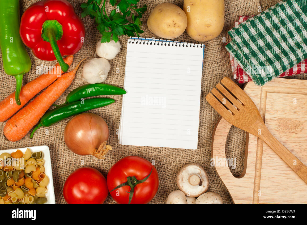 Notebook to write recipes and vegetables around it Stock Photo - Alamy