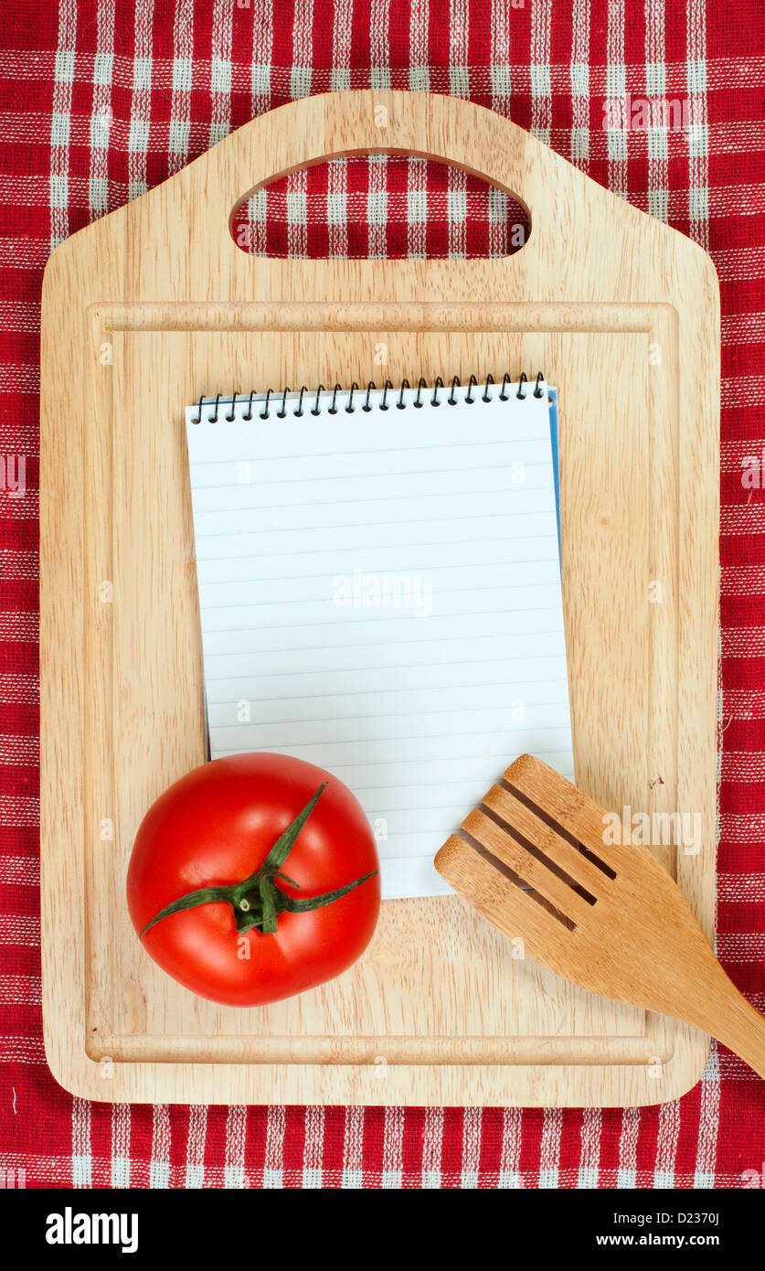 Notebook to write recipes and vegetables around it Stock Photo - Alamy