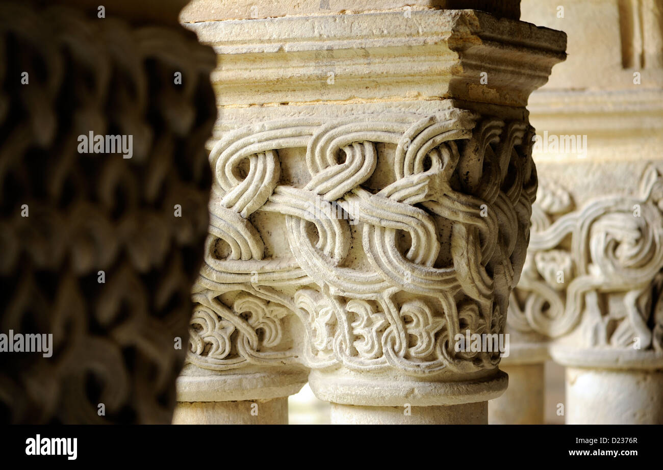 Intracately carved capitals on columns supporting arches that form ...