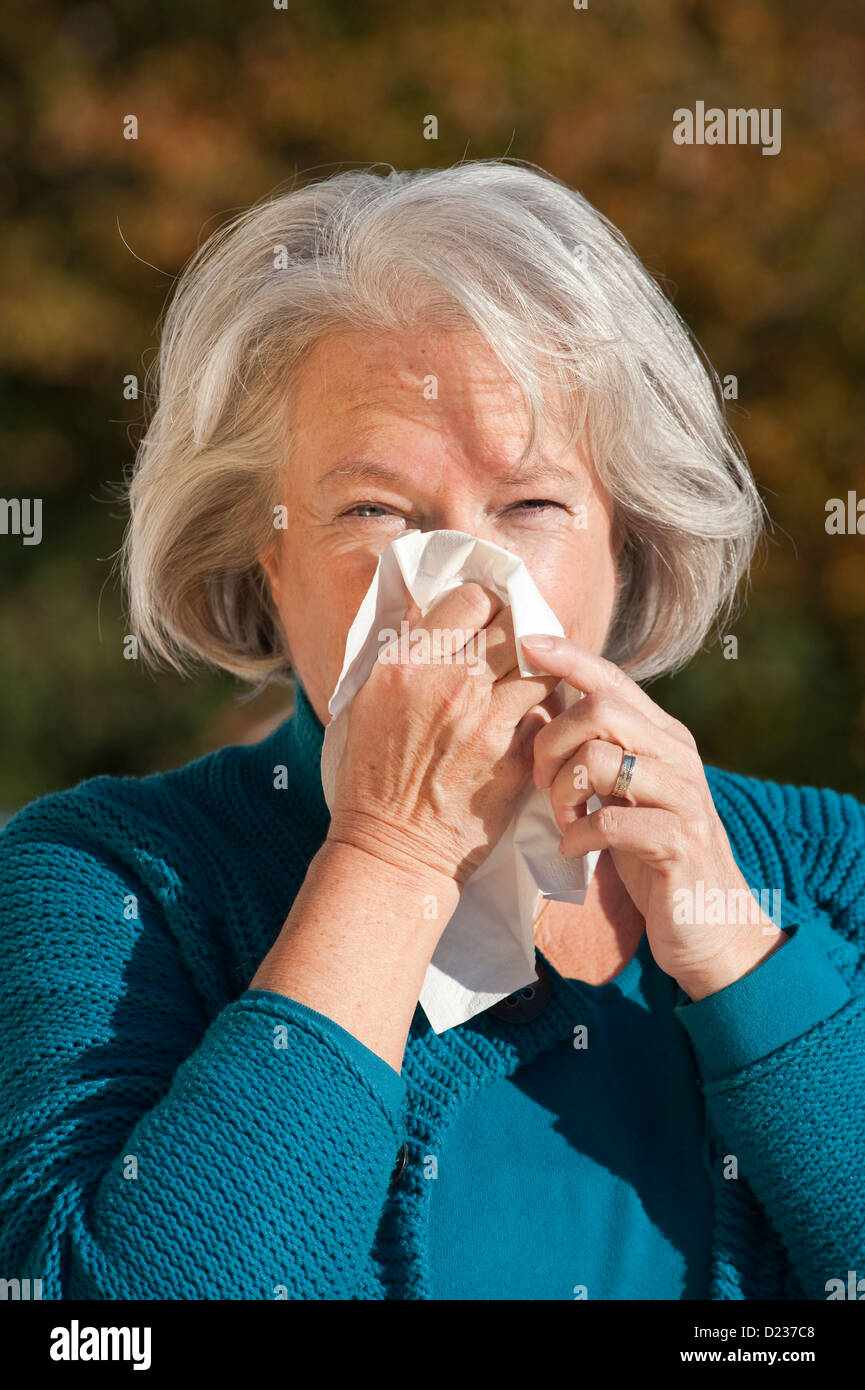Elderly woman has flu Stock Photo - Alamy