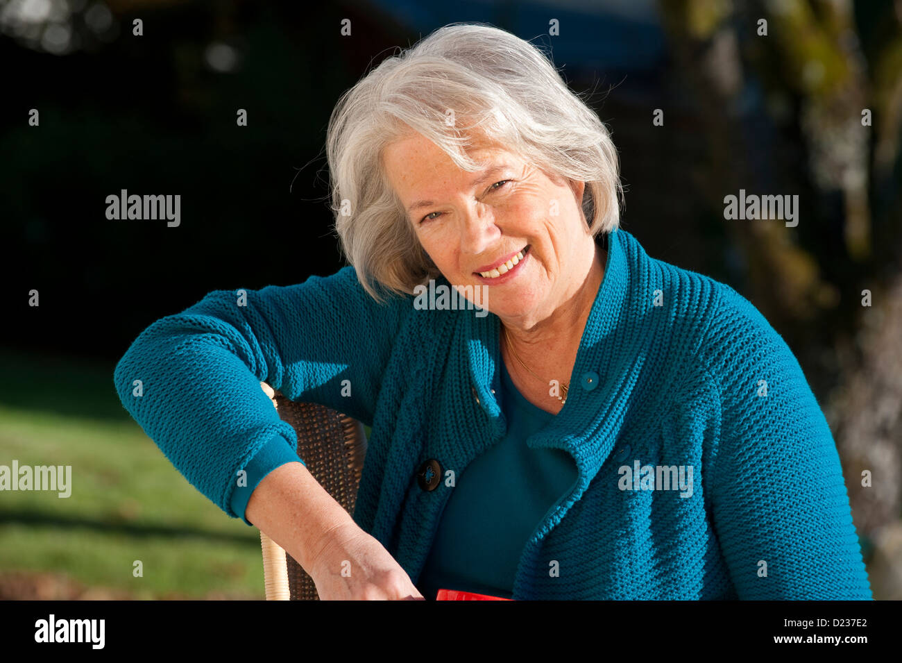 Elderly woman in the garden Stock Photo - Alamy
